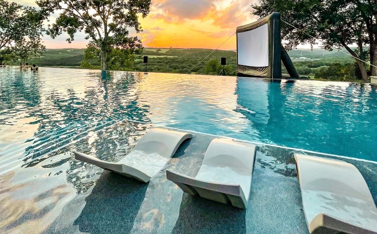 Sip Cocktails While Watching Movies In The Pool This Summer In Texas