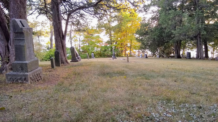 Red Rock Cemetery In Iowa Is Perched On A Hill Above The Lake