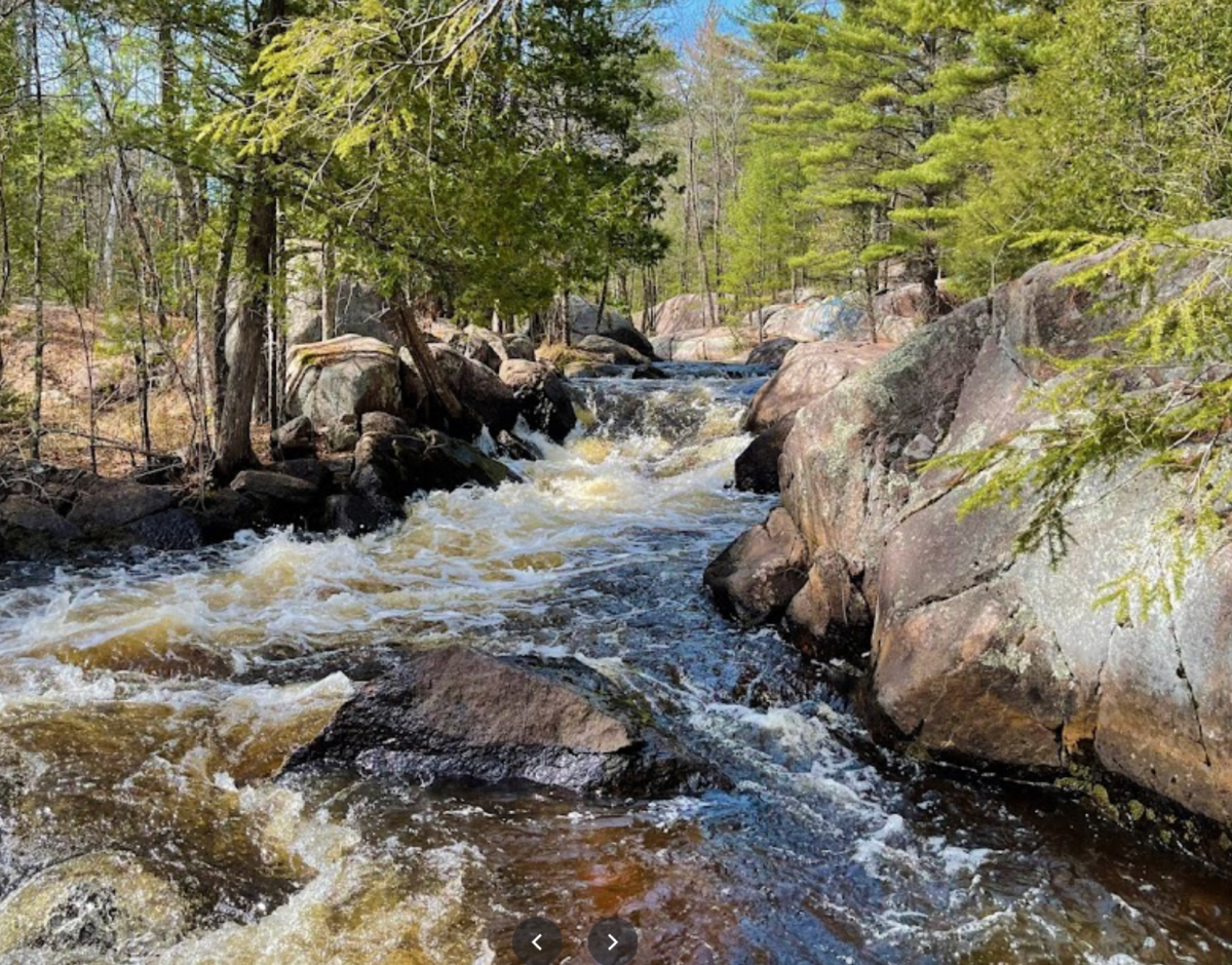A Trail By A Scenic Bridge Leads To Waterfall Paradise In Wisconsin