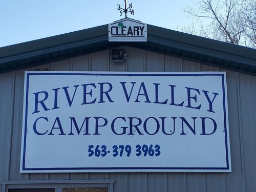 Sign for River Valley Campground, featuring the name and contact number ...