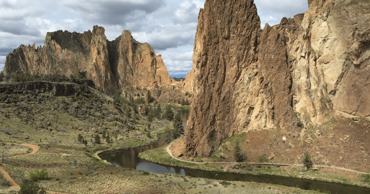 This Oregon Trail Along A River With Towering Rocks Can't Be Beat